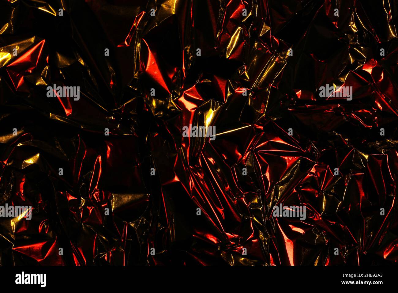 Foil background. Crumpled foil. Abstract background. Wallpaper. Red ...