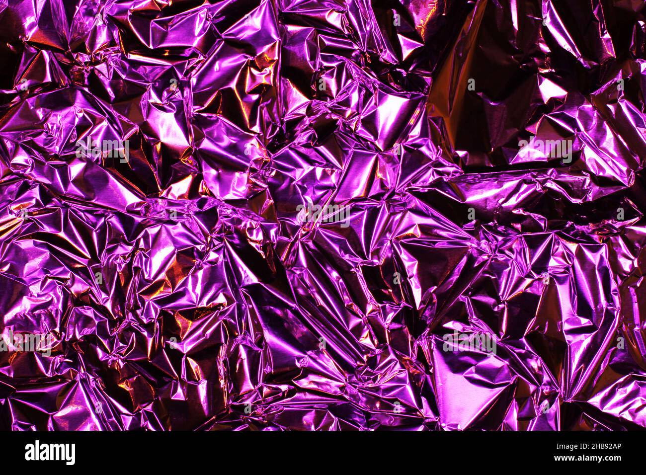 Foil background. Crumpled foil. Abstract background. Wallpaper. Pink ...