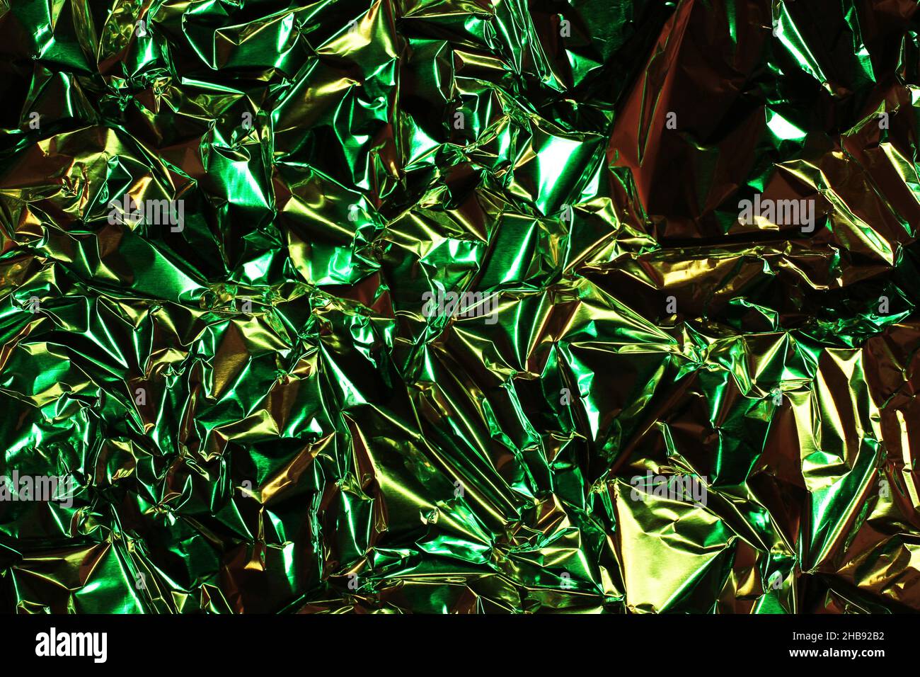 Foil background. Crumpled foil. Abstract background. Wallpaper. Green ...