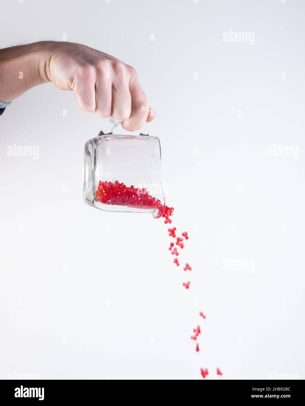 Pouring of Colorful plastic beads. Microplastics. Industrial plastic ...