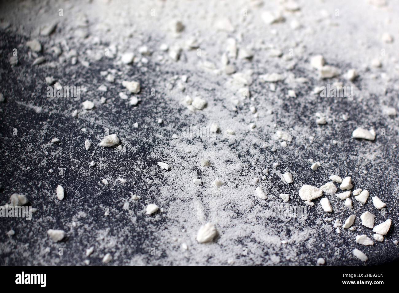 White dust. White powder. Scattering white particles. Abstract ...