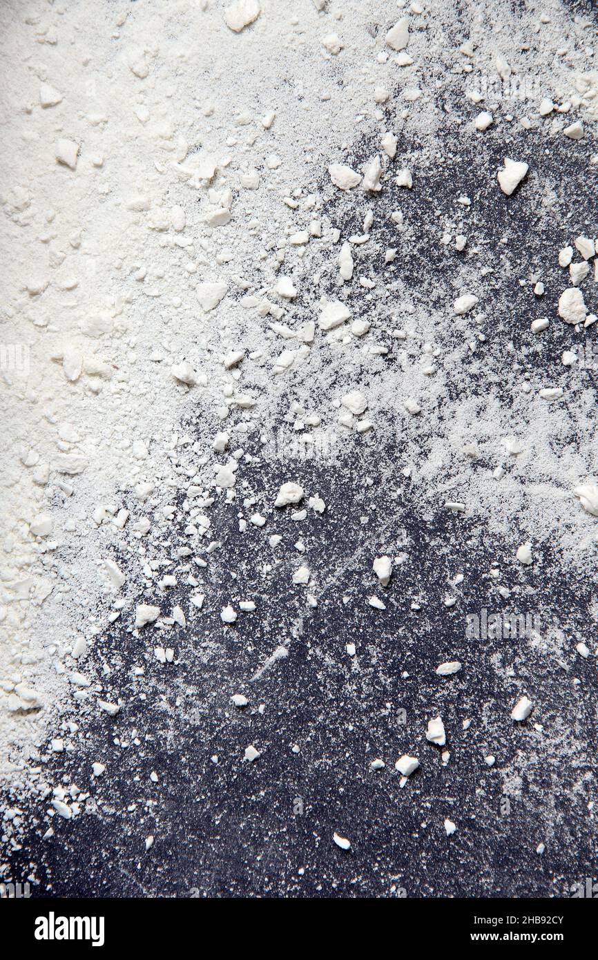 White dust. White powder. Scattering white particles. Abstract ...