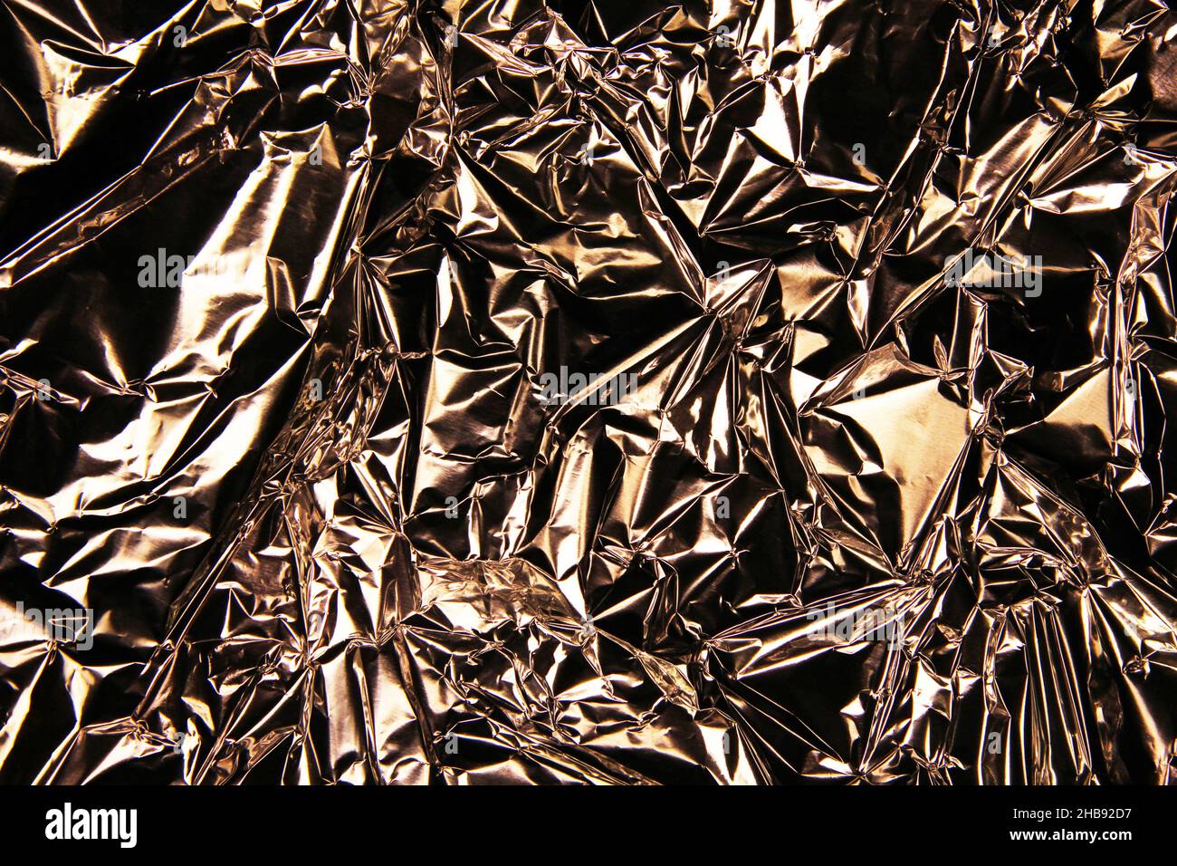 Foil background. Crumpled foil. Abstract background. Wallpaper. Brown ...