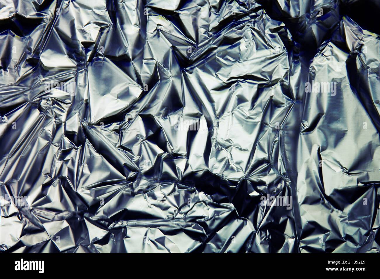 Foil background. Crumpled foil. Abstract background. Wallpaper Stock ...