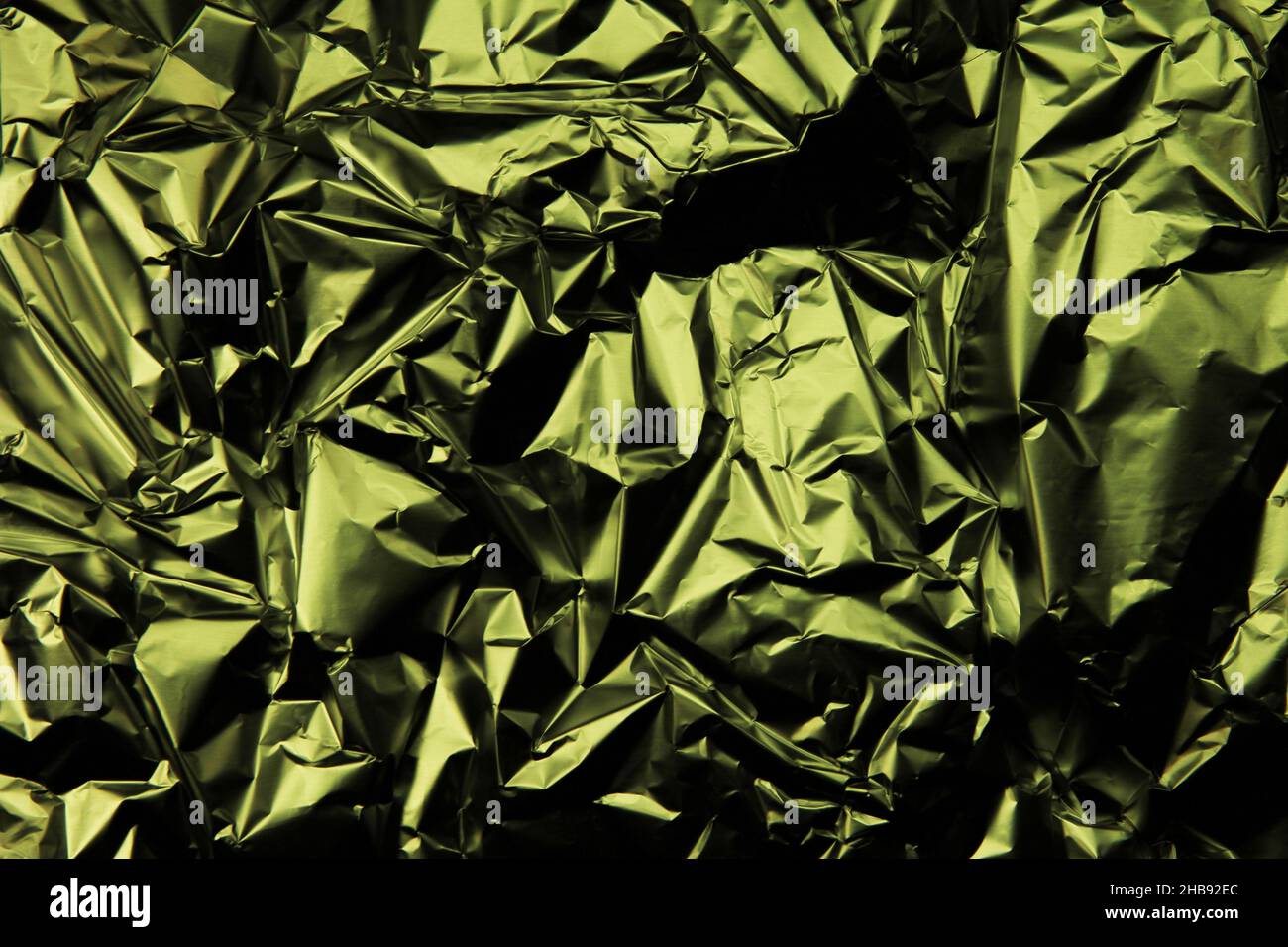 Foil background. Crumpled foil. Abstract background. Wallpaper. Green ...