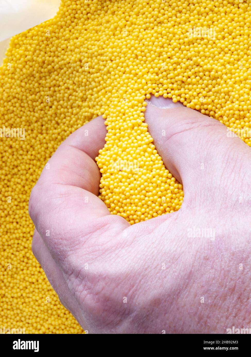 Handful of Colorful plastic beads. Microplastics. Industrial plastic ...