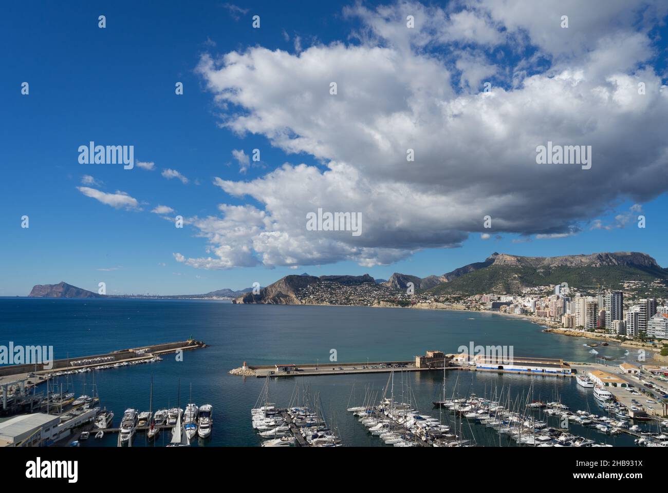 sailboats in the marina of Calpe and clouds on the Mediterranean coast ...