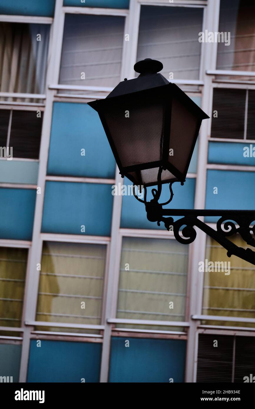 Closeup of a black lamp post in Exterior Lights with colorful wooden ...