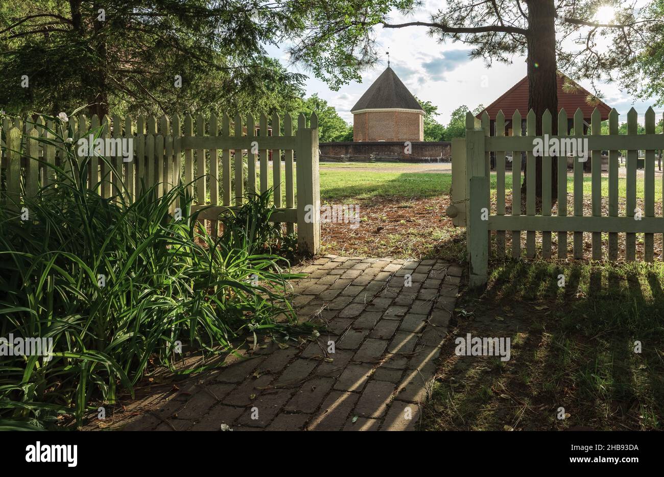 Old buildings in the fenced area with dense greenery in Colonial ...
