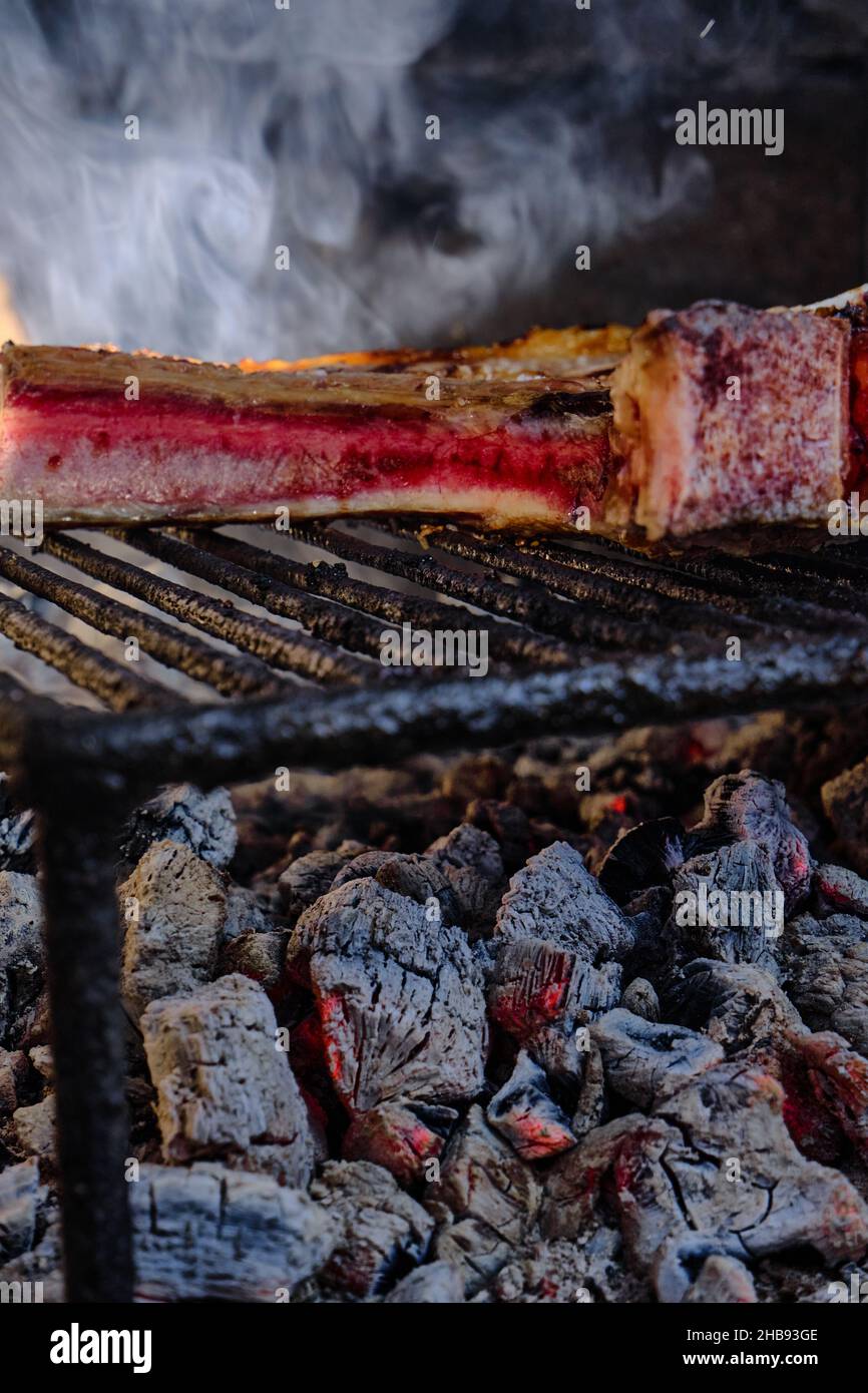 Closeup of a steak meet beef on a grill with smoke Stock Photo - Alamy