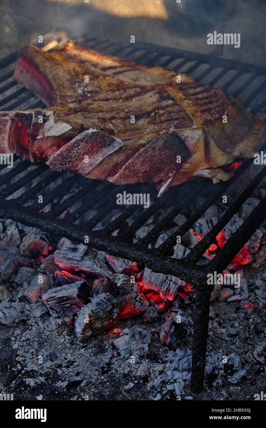 Closeup of a steak meet beef on a grill with smoke Stock Photo - Alamy