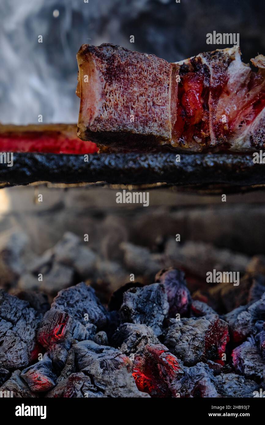 Closeup of a steak meet beef on a grill with smoke Stock Photo - Alamy