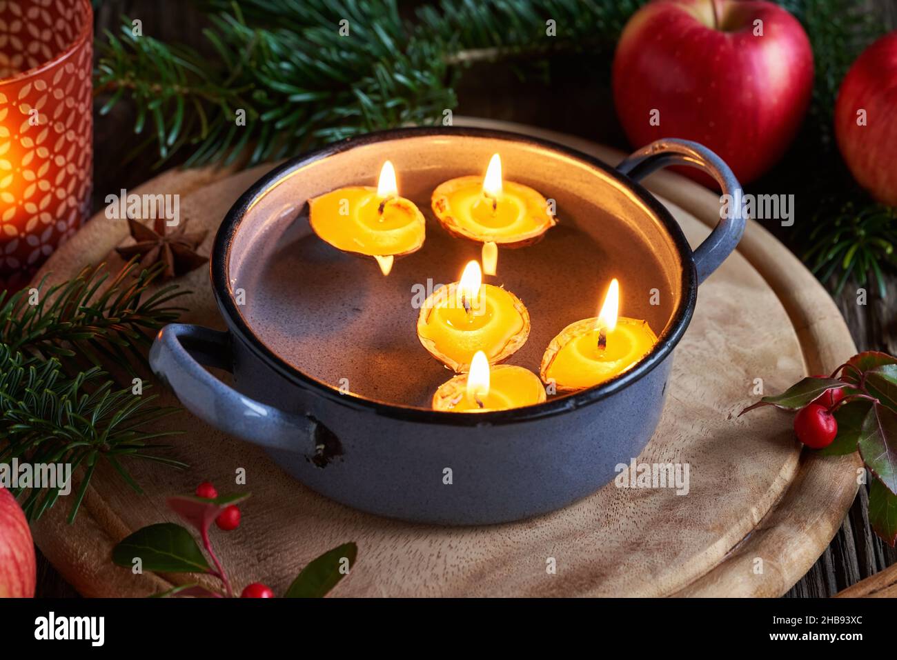 Candles made from walnut shells and bees wax floating in water - old ...