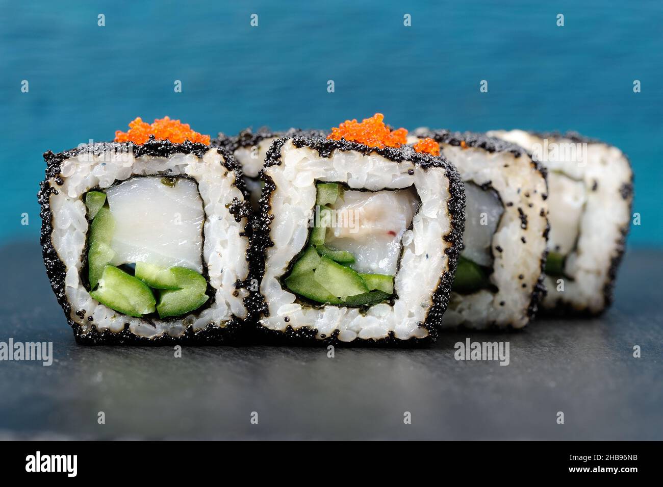 Set of square sushi rolls with white fish, vegs, cream cheese and ...