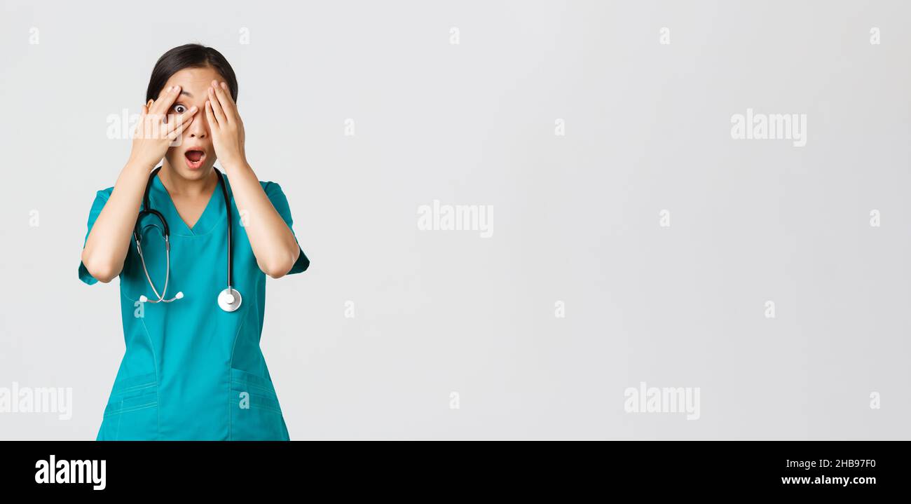 Covid-19, healthcare workers and preventing virus concept. Scared and ...