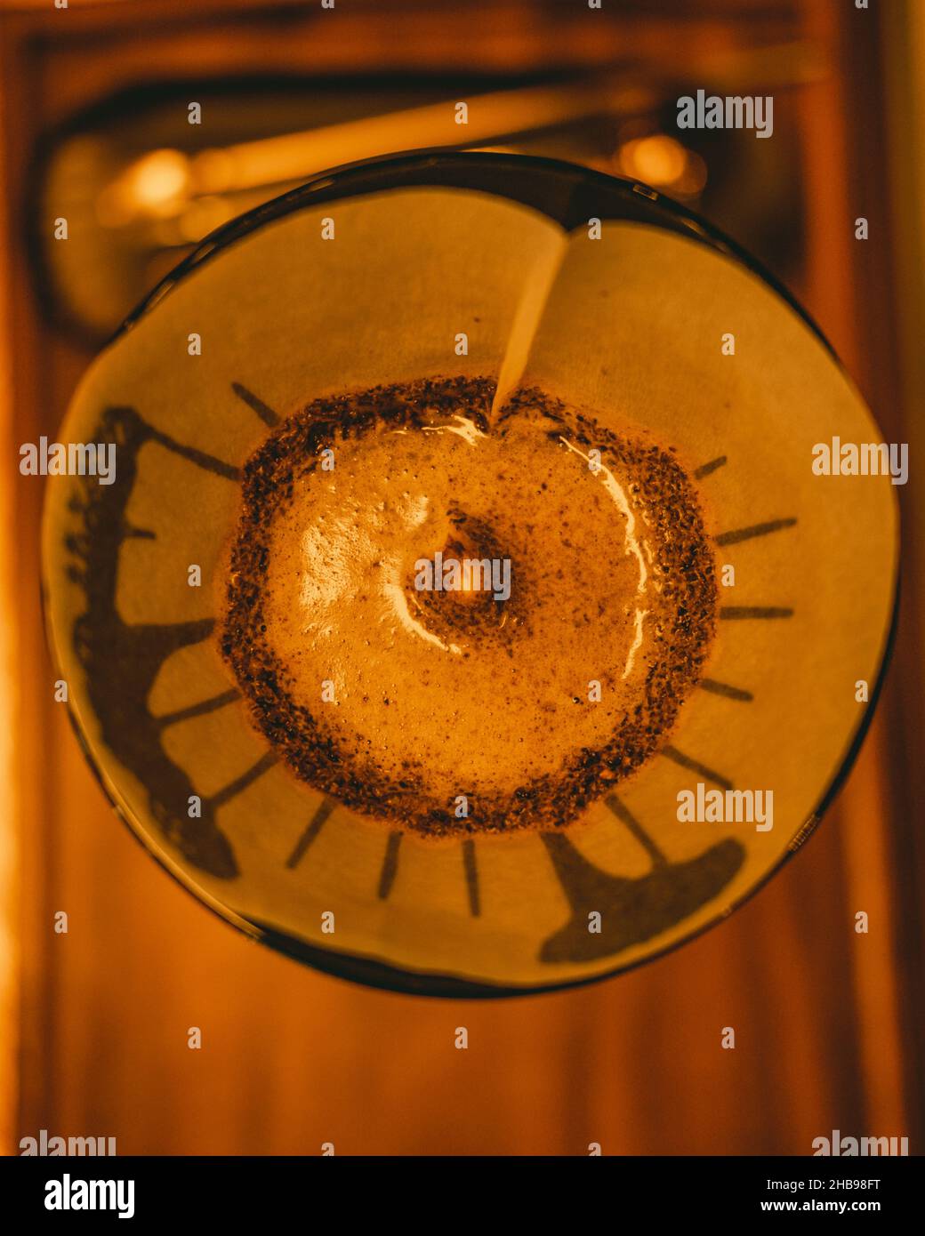 Vertical top view of coffee running through a filter Stock Photo - Alamy