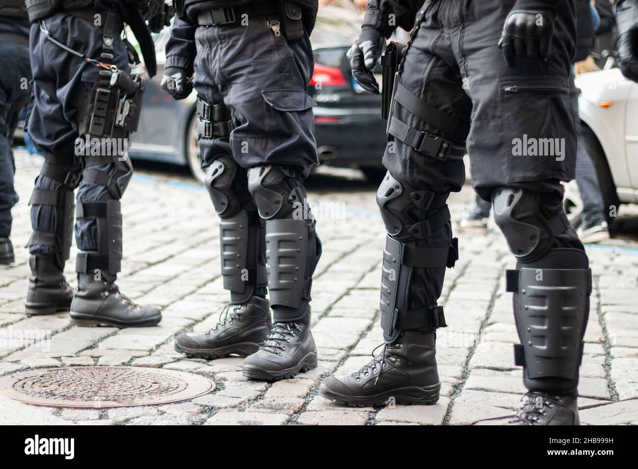 Police force cordon at city street. Close-up view to special forces ...