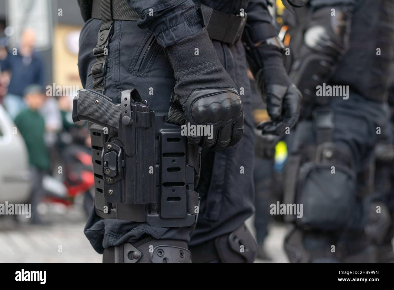 Close-up view to armed police officer with gun. Special force with ...
