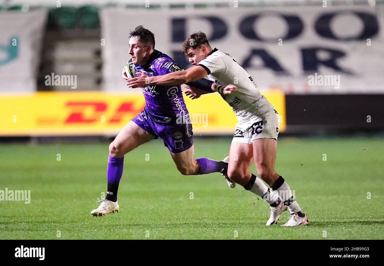 Dragons Sam Davies is tackled by Lyon’s Thibault Regard during the EPCR ...