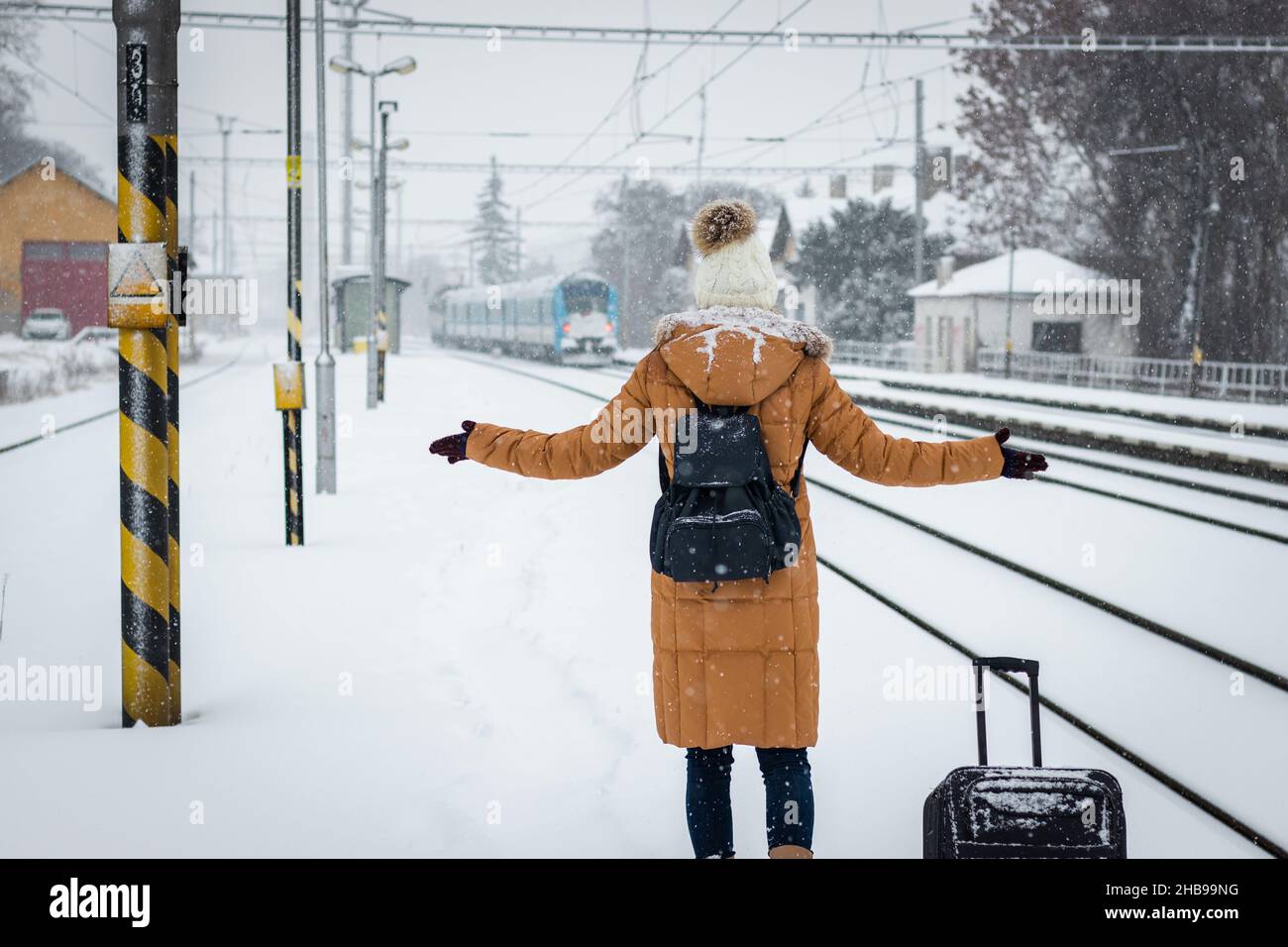 Woman traveler missed the train. Tourist looking at leaving train at ...