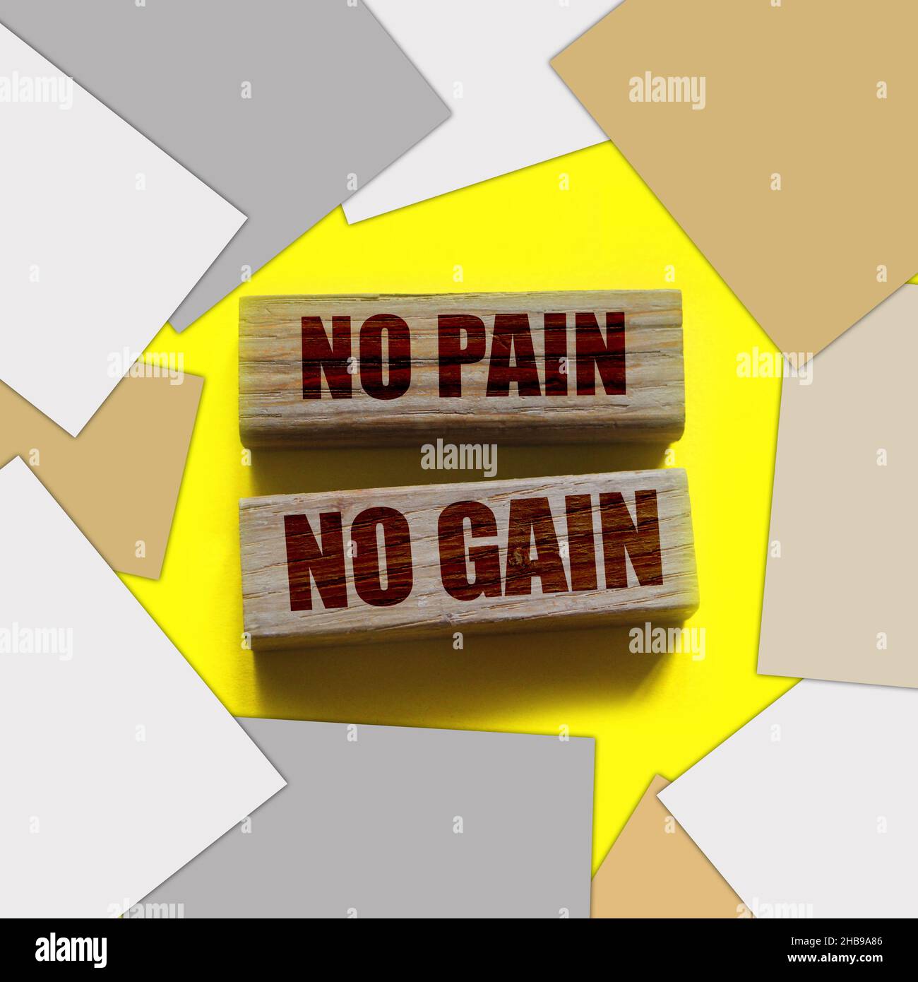 No Pain No Gain message written with wooden blocks on yellow. Business ...