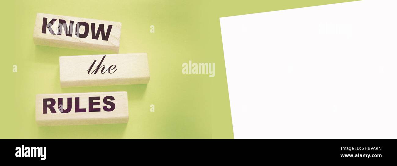 Know the rules word on wooden blocks isolated on dark grey background ...