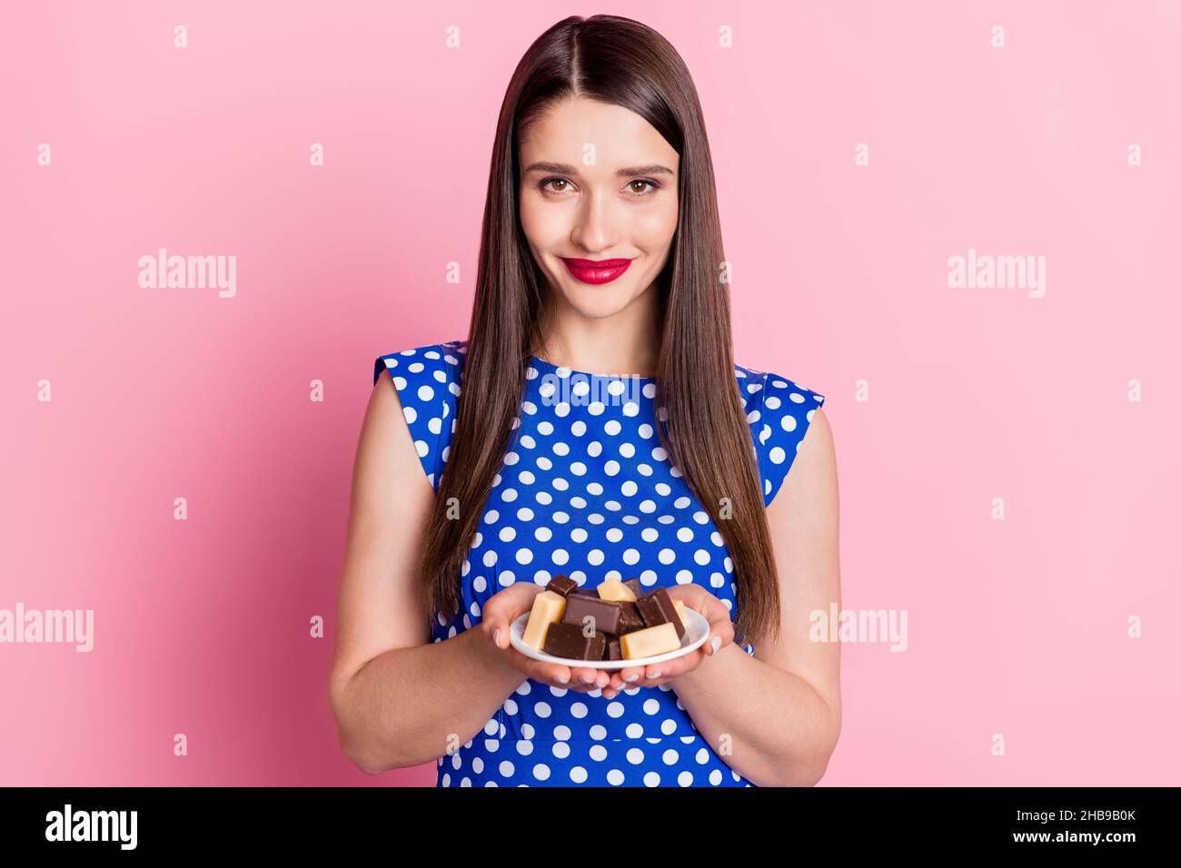 Portrait of attractive cheery cunning hungry girl holding plate with ...