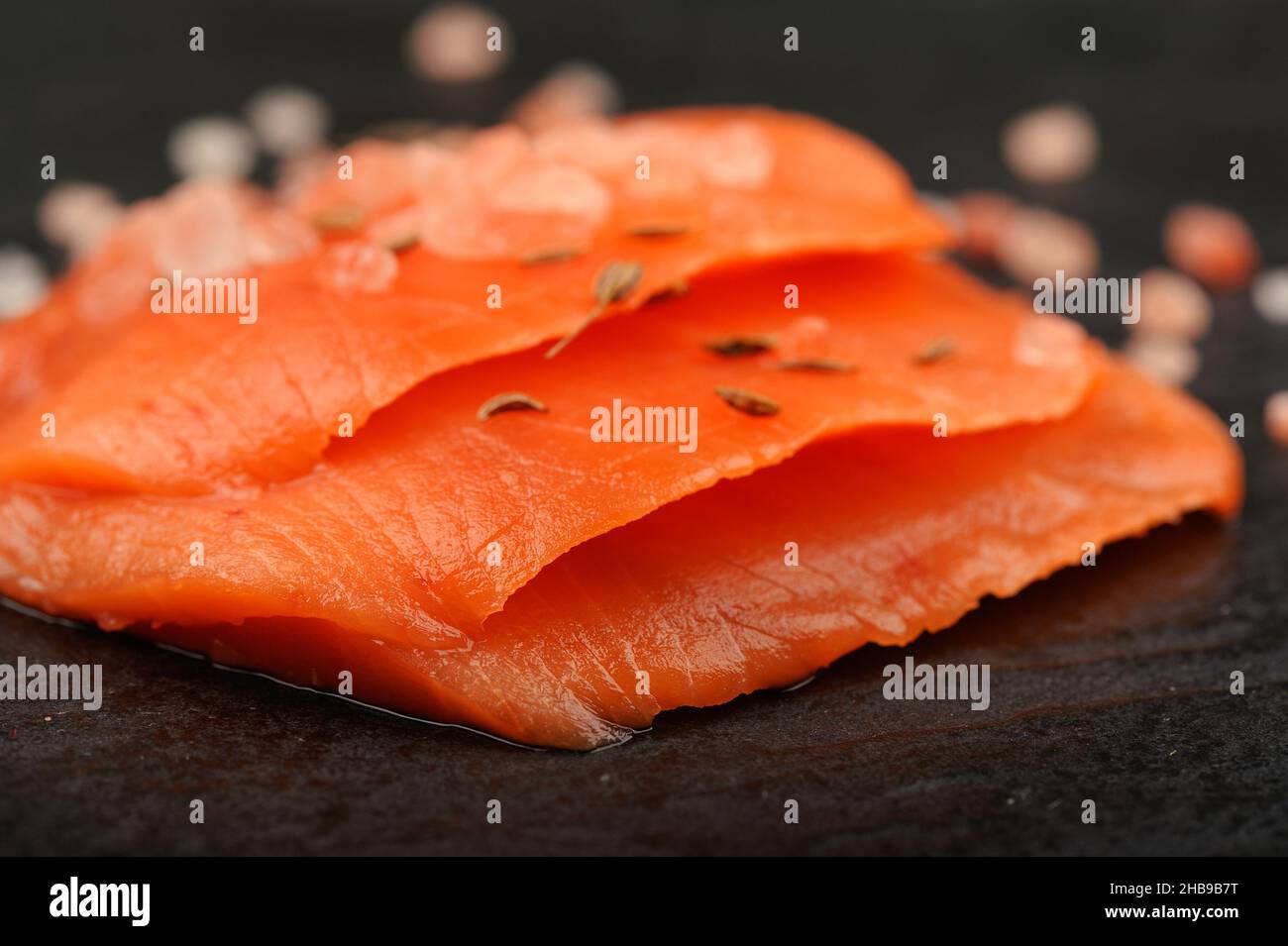 Wild salmon salted with pink himalayan salt closeup Stock Photo - Alamy