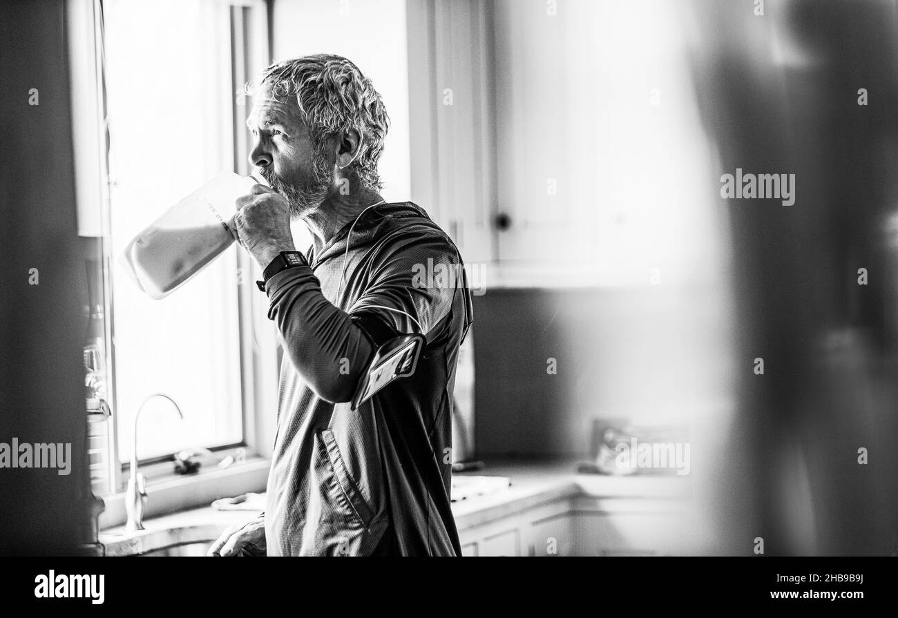 Man in kitchen milk Black and White Stock Photos & Images - Alamy