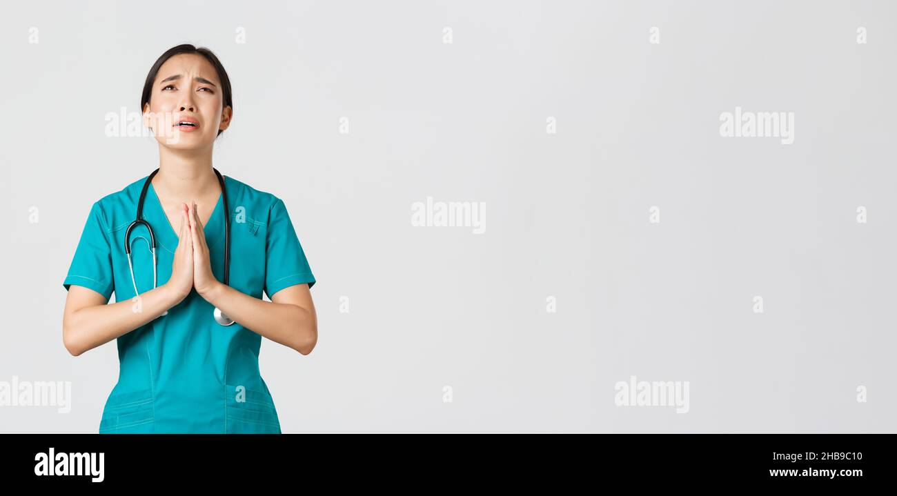 Covid-19, healthcare workers, pandemic concept. Overworked sad and ...