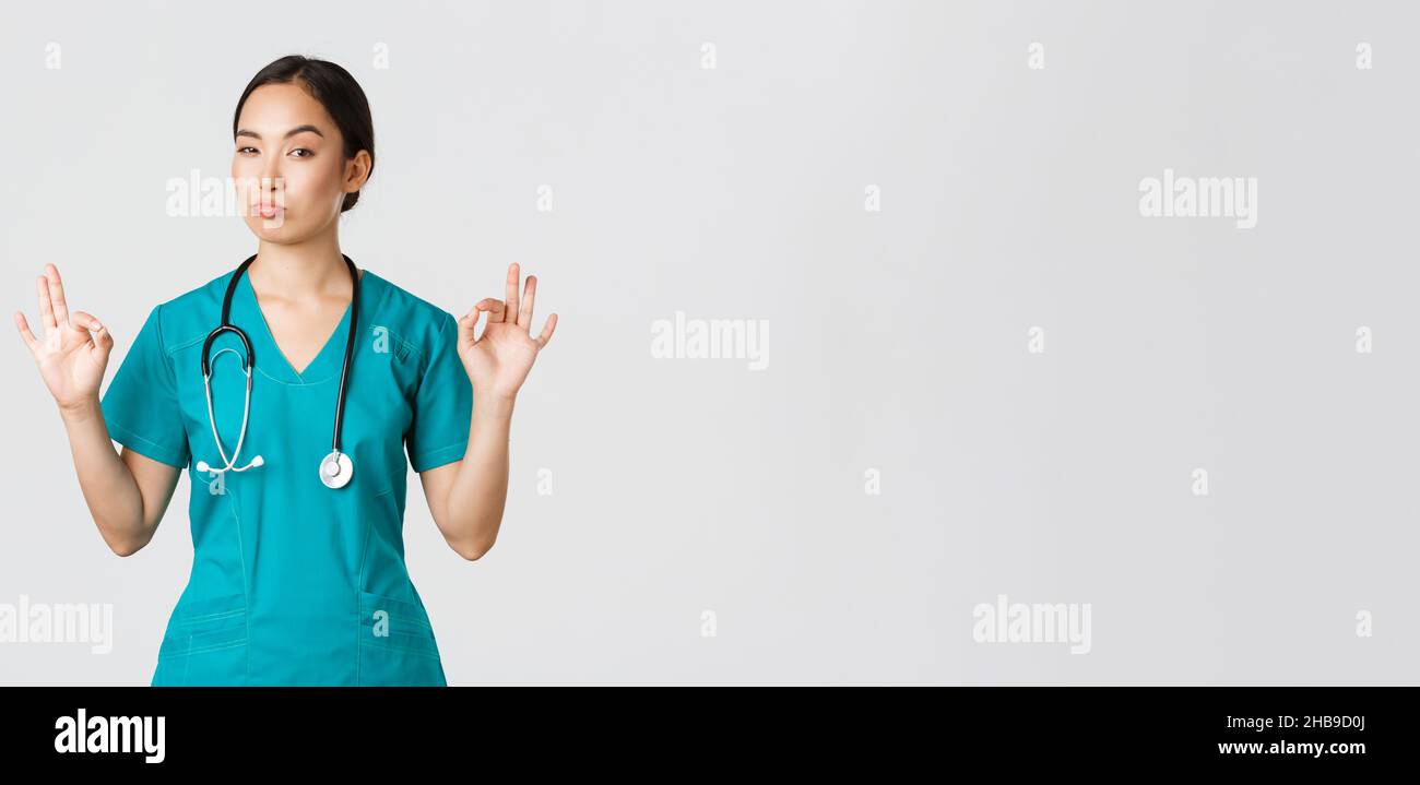 Covid-19, healthcare workers, pandemic concept. Impressed good-looking ...