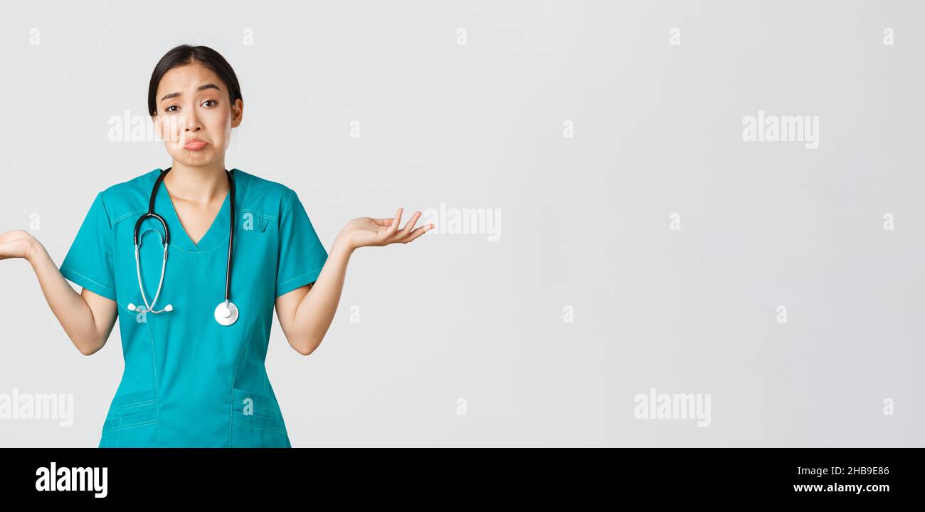 Covid-19, healthcare workers, pandemic concept. Portrait of clueless ...