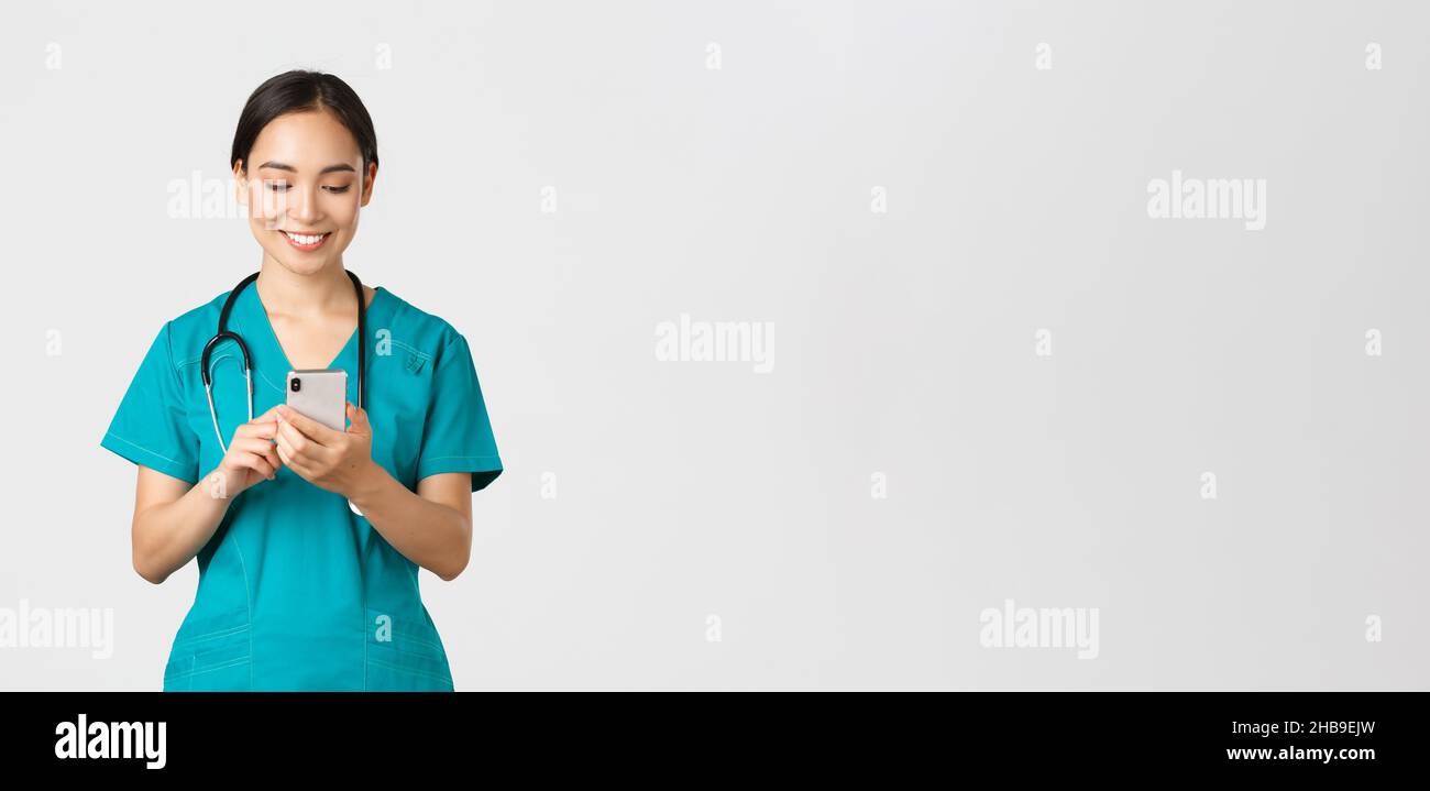 Covid-19, healthcare workers and preventing virus concept. Smiling ...