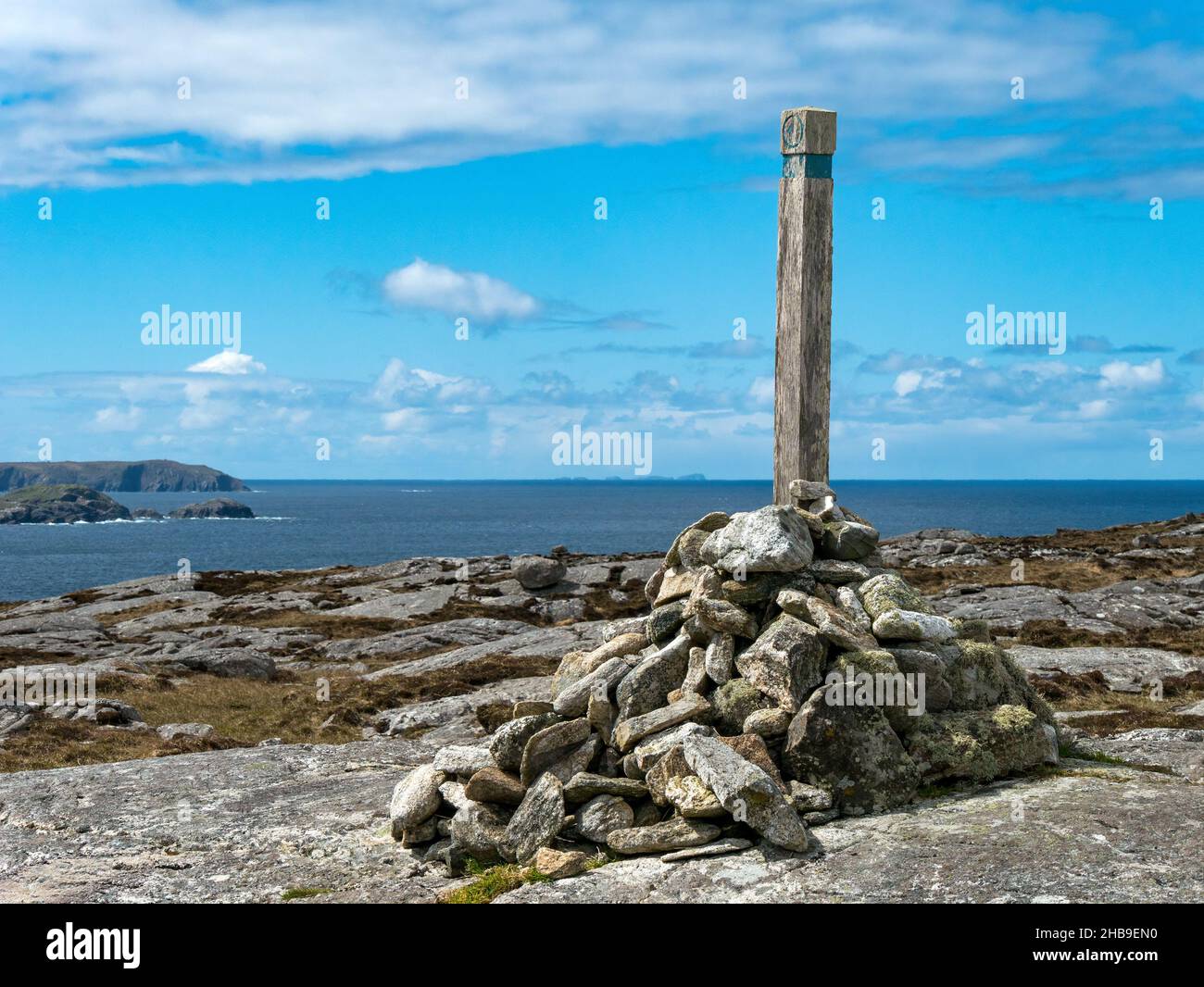 Old wooden waymarker post at the summit of Beinn an Toib on the ...