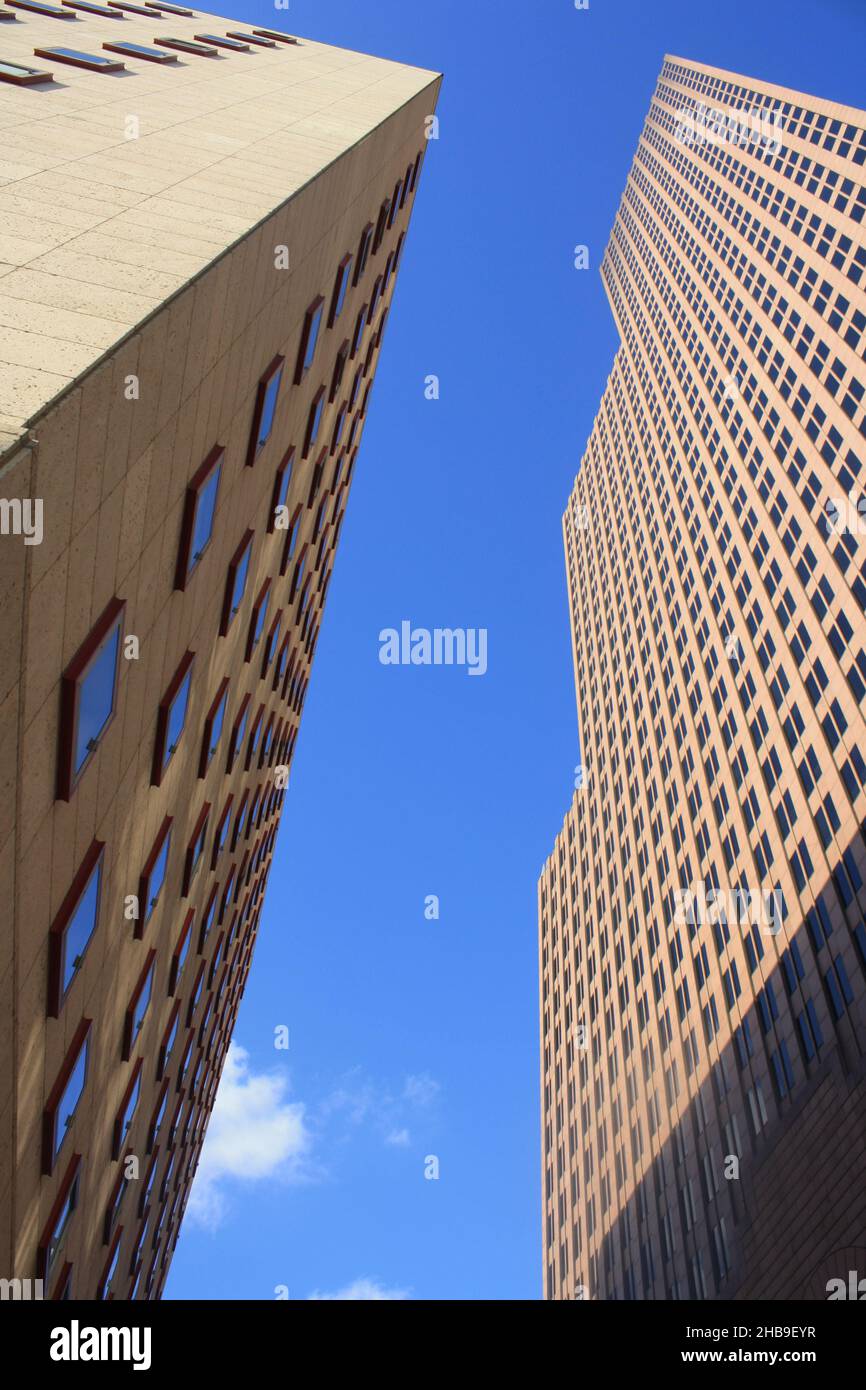 Towering Angles in the Sky-two side by side buildings form perfect ...