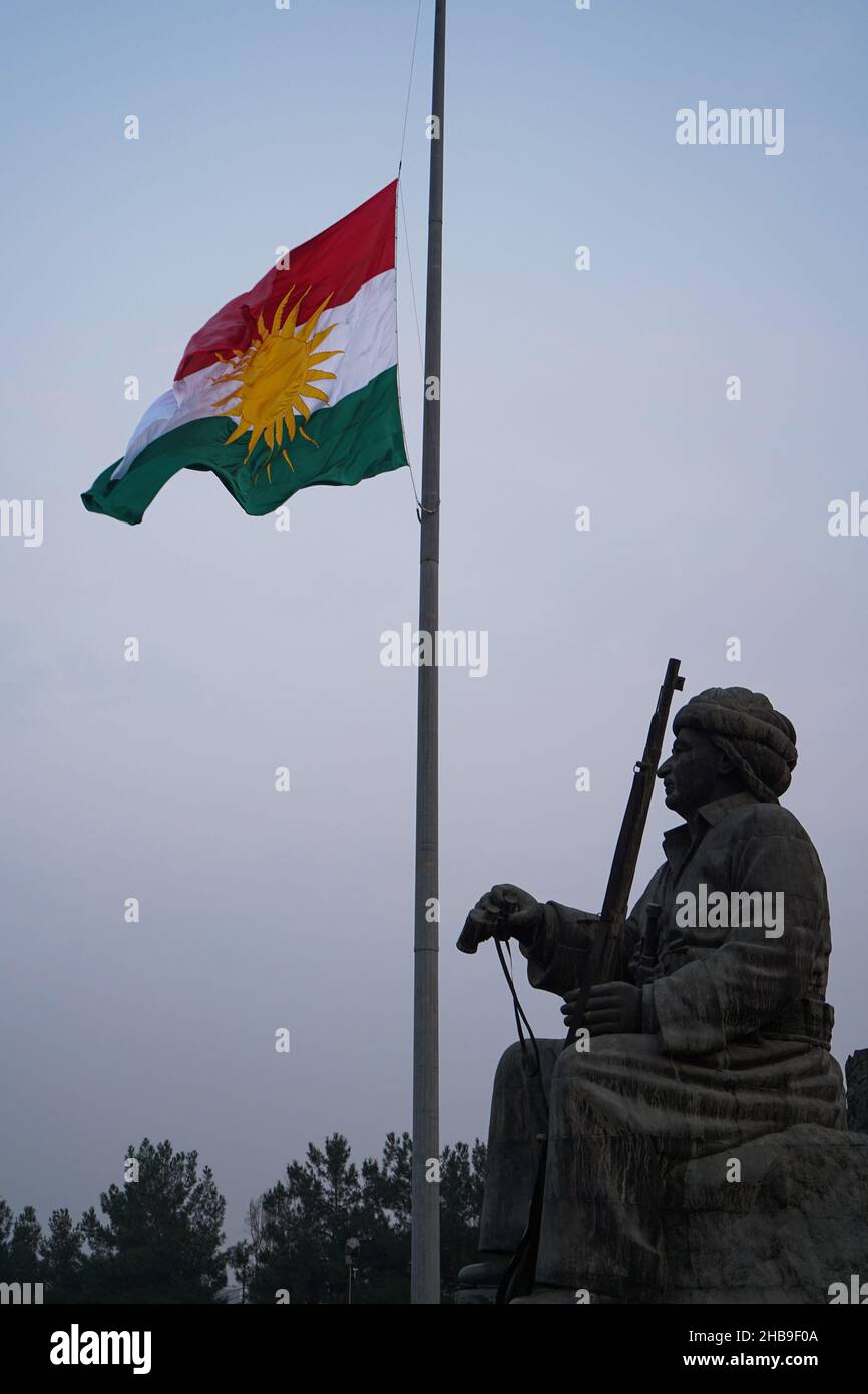 The Kurdistan flag seen waving over a statue of Kurdish leader Mulla ...