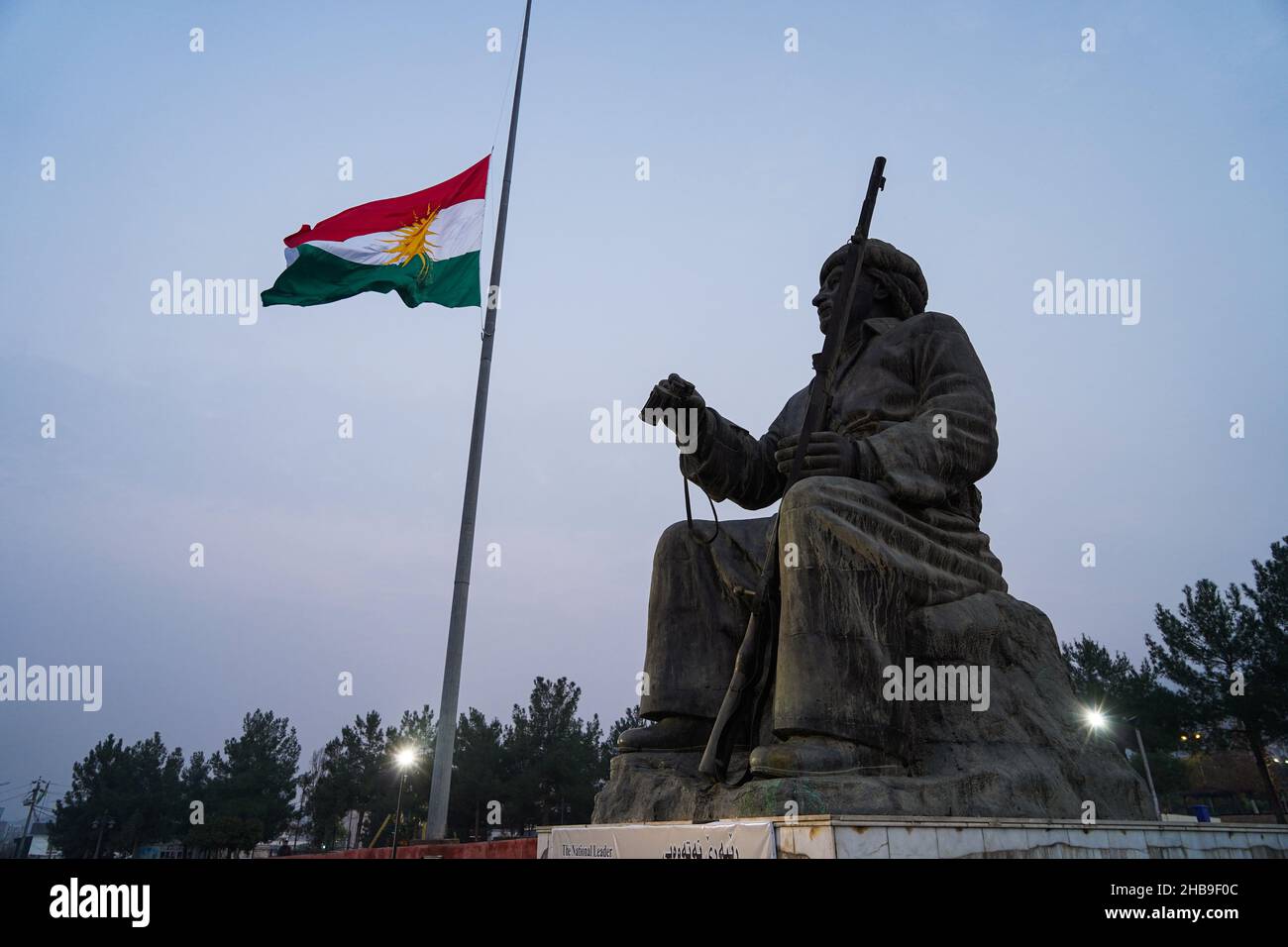 The Kurdistan flag seen waving over a statue of Kurdish leader Mulla ...