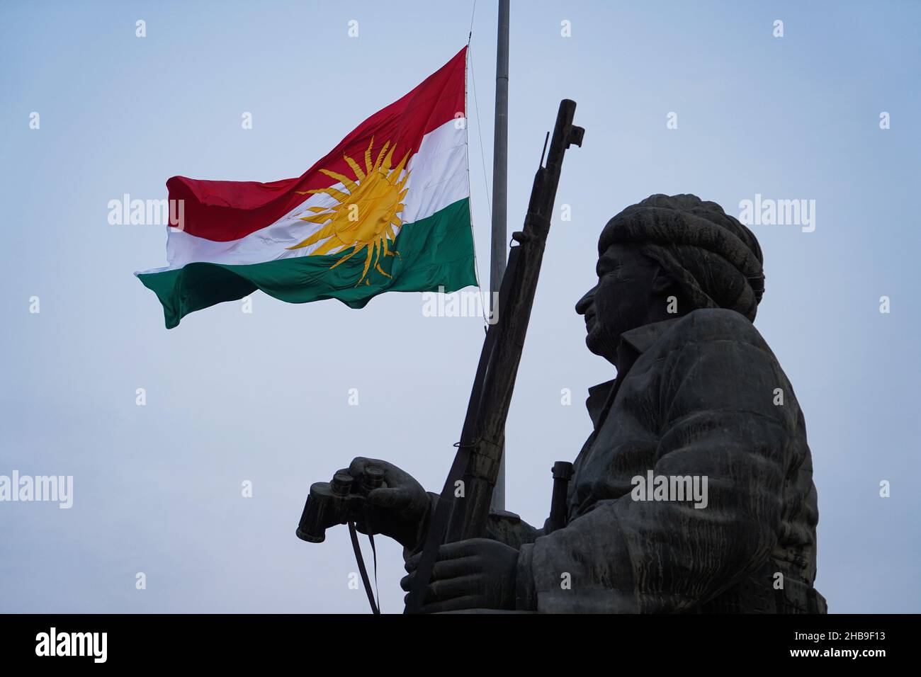 The Kurdistan flag seen waving over a statue of Kurdish leader Mulla ...