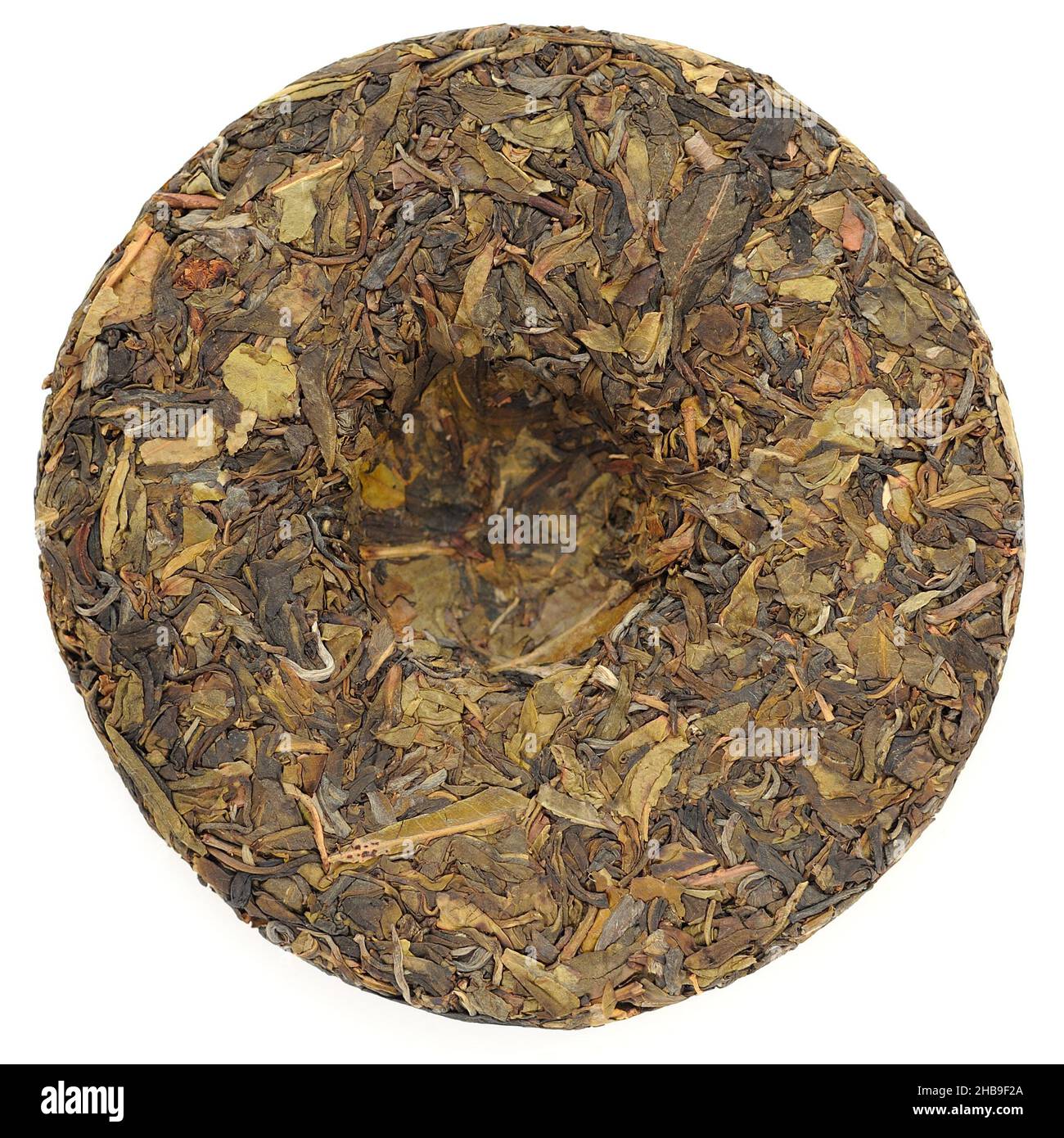 Jingmai Gu Shu Huang Pian Raw Puerh tea in round shape isolated top ...