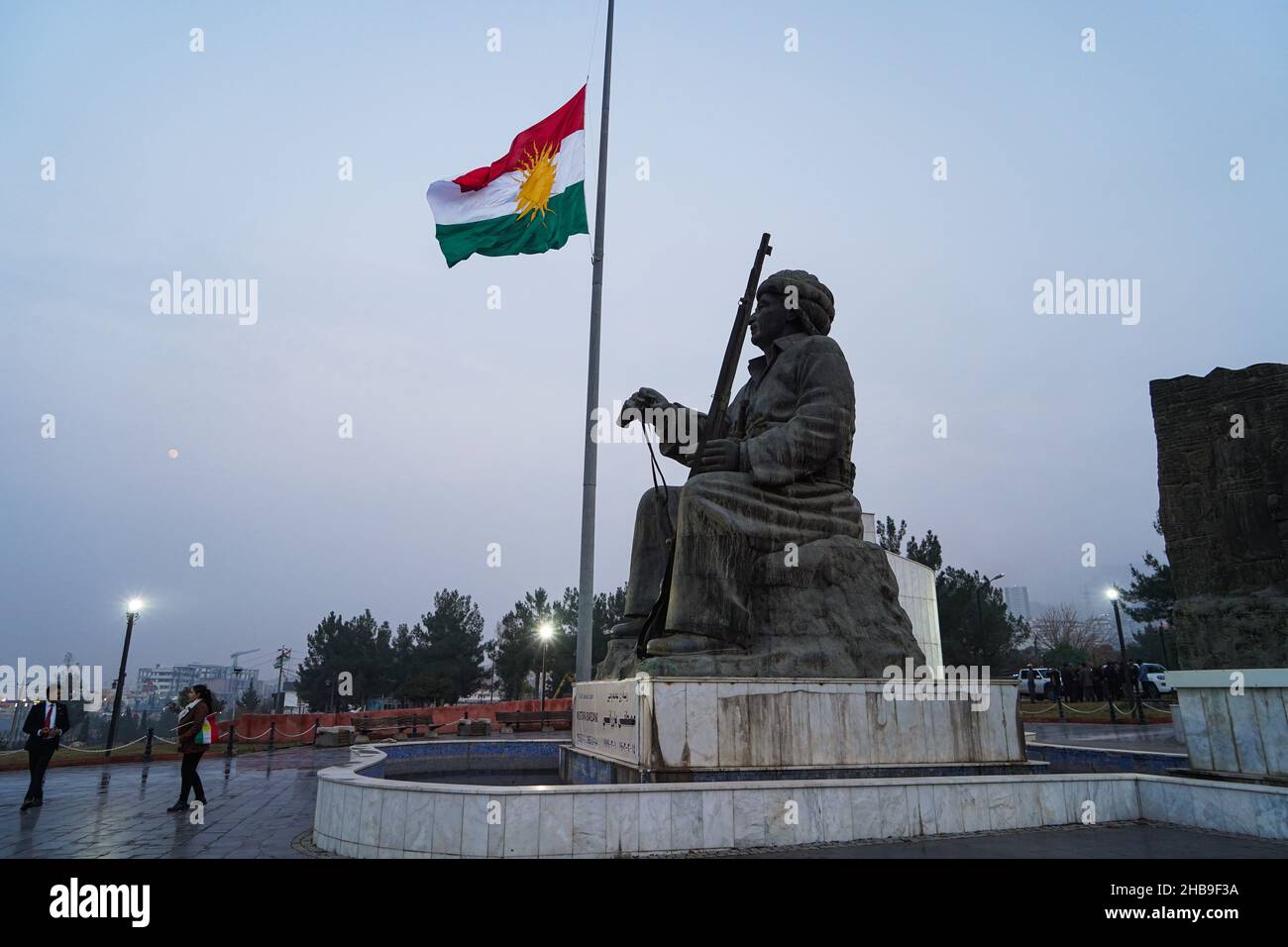 The Kurdistan flag seen waving over a statue of Kurdish leader Mulla ...