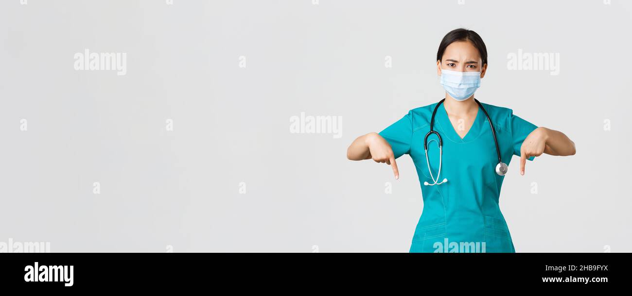 Covid-19, coronavirus disease, healthcare workers concept. Serious ...