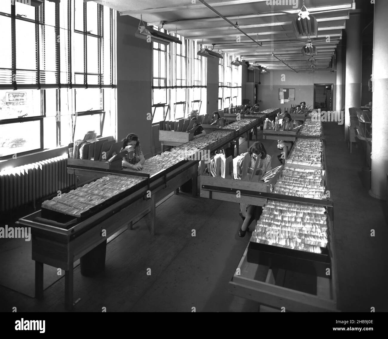Large room full of paper documents with workers doing filing in a Sears ...