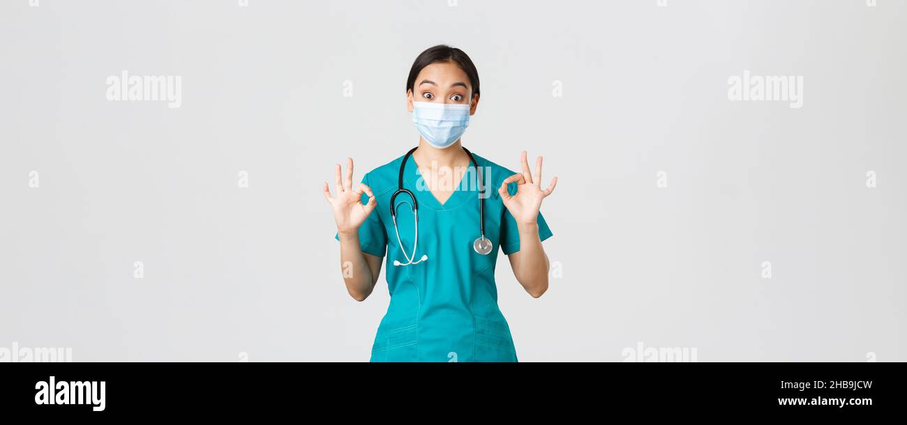 Covid-19, coronavirus disease, healthcare workers concept. Excited and ...