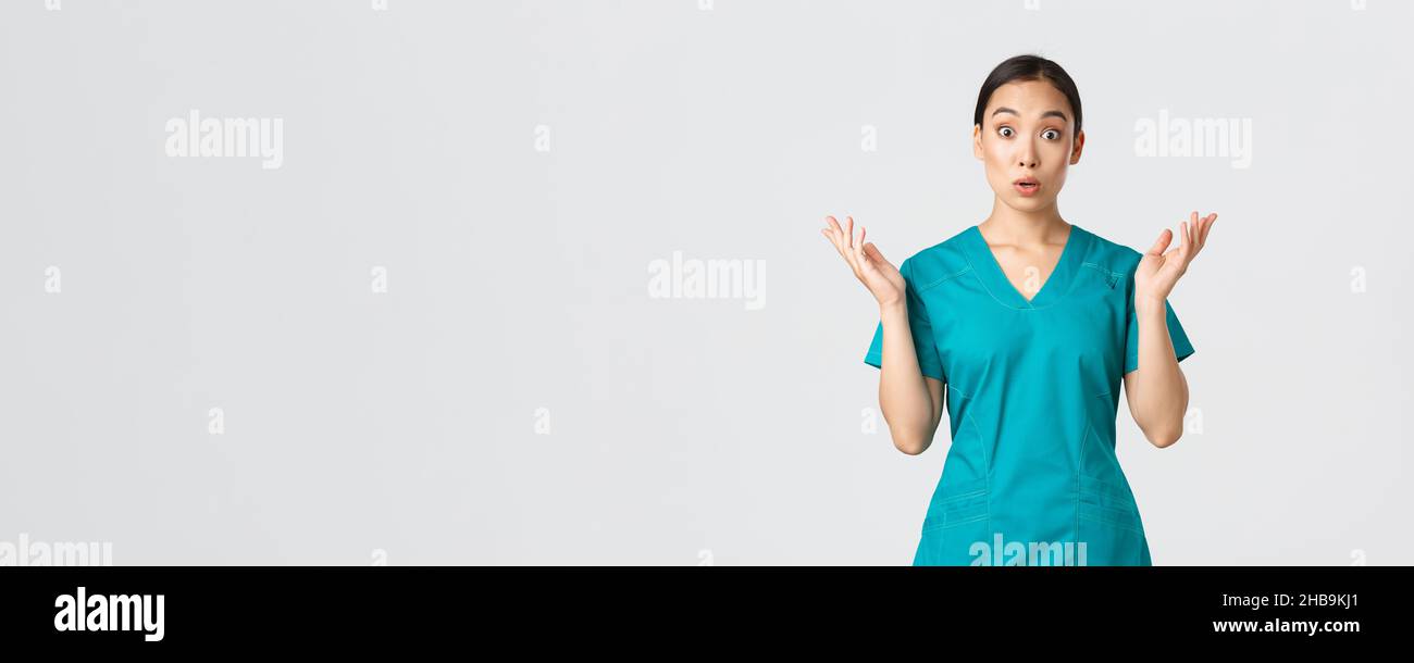 Covid-19, healthcare workers, pandemic concept. Surprised and amazed ...