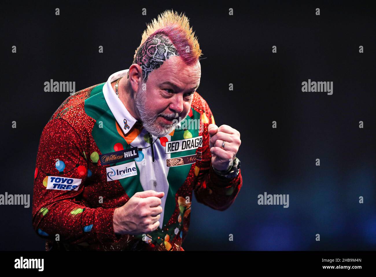 Peter Wright celebrates after winning the opening set against Ryan ...