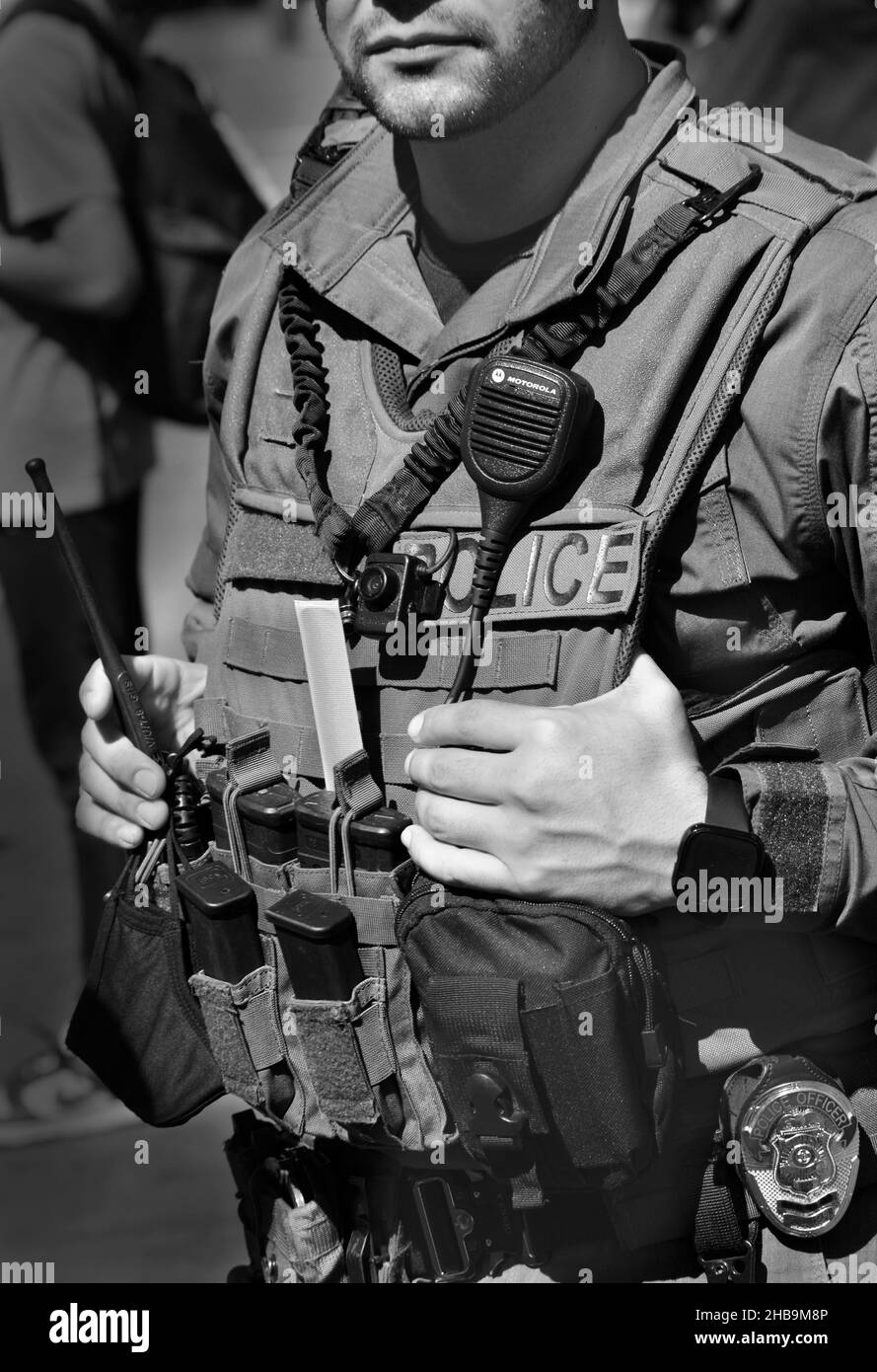 A member of the Santa Fe, New Mexico, SWAT team keeps on eye on the ...