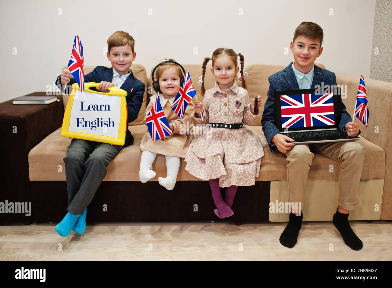 Four kids show inscription learn english. Foreign language learning ...
