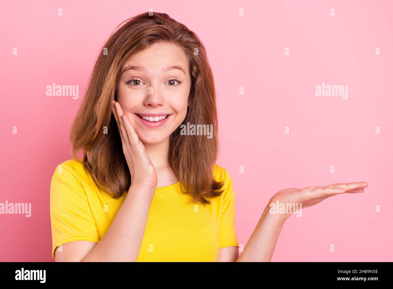 Photo of young excited girl happy positive smile show product advertise ...
