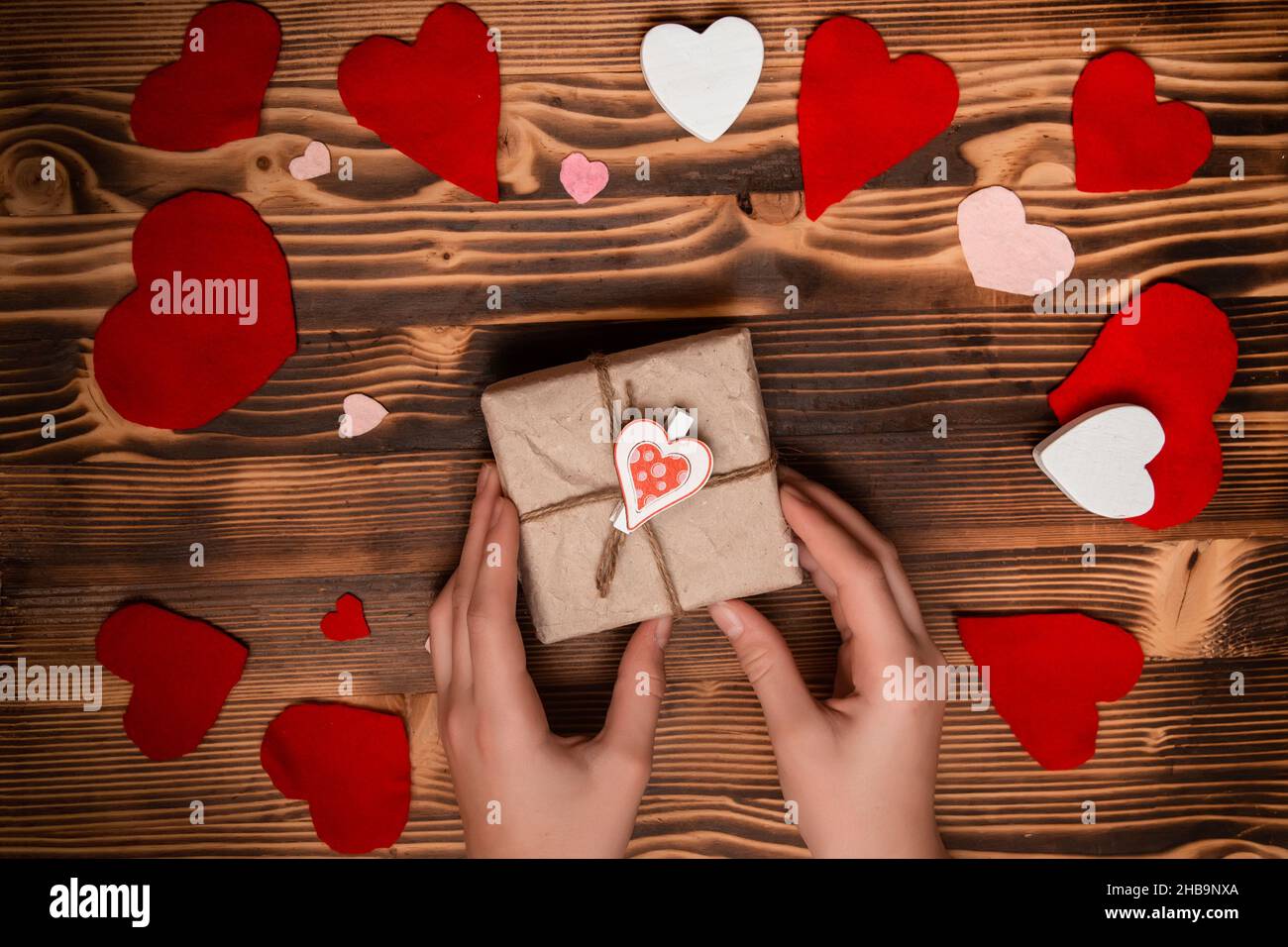 Gift in craft packaging for Valentine's Day Stock Photo - Alamy