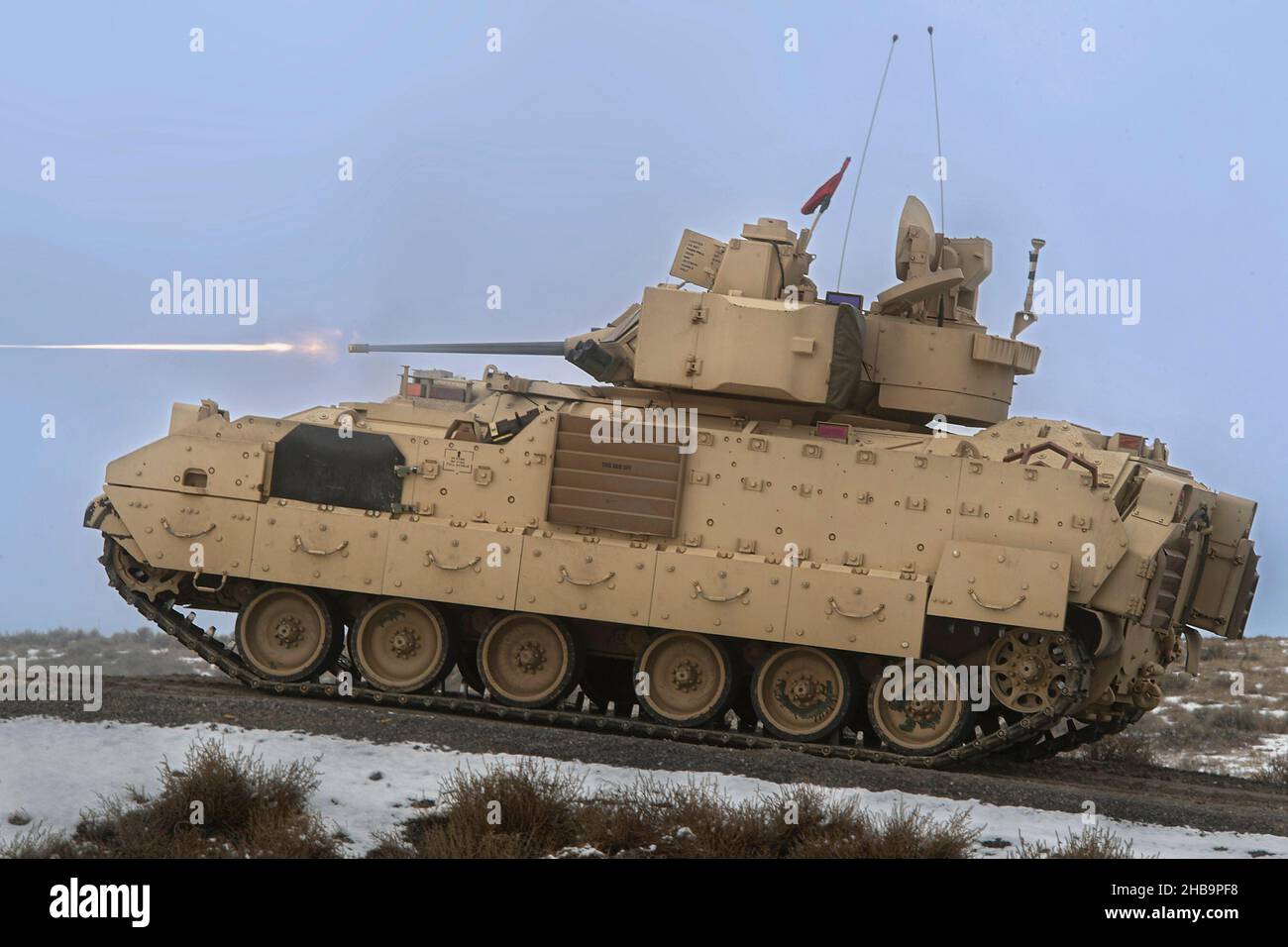 The Bradley Fighting Vehicle cuts loose several rounds from the 25mm ...